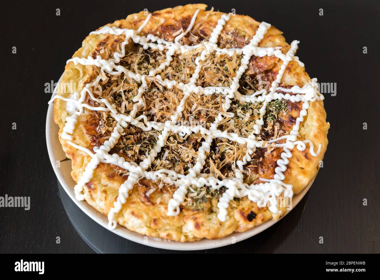 okonomiyaki japanese pizza Osaka style Stock Photo - Alamy