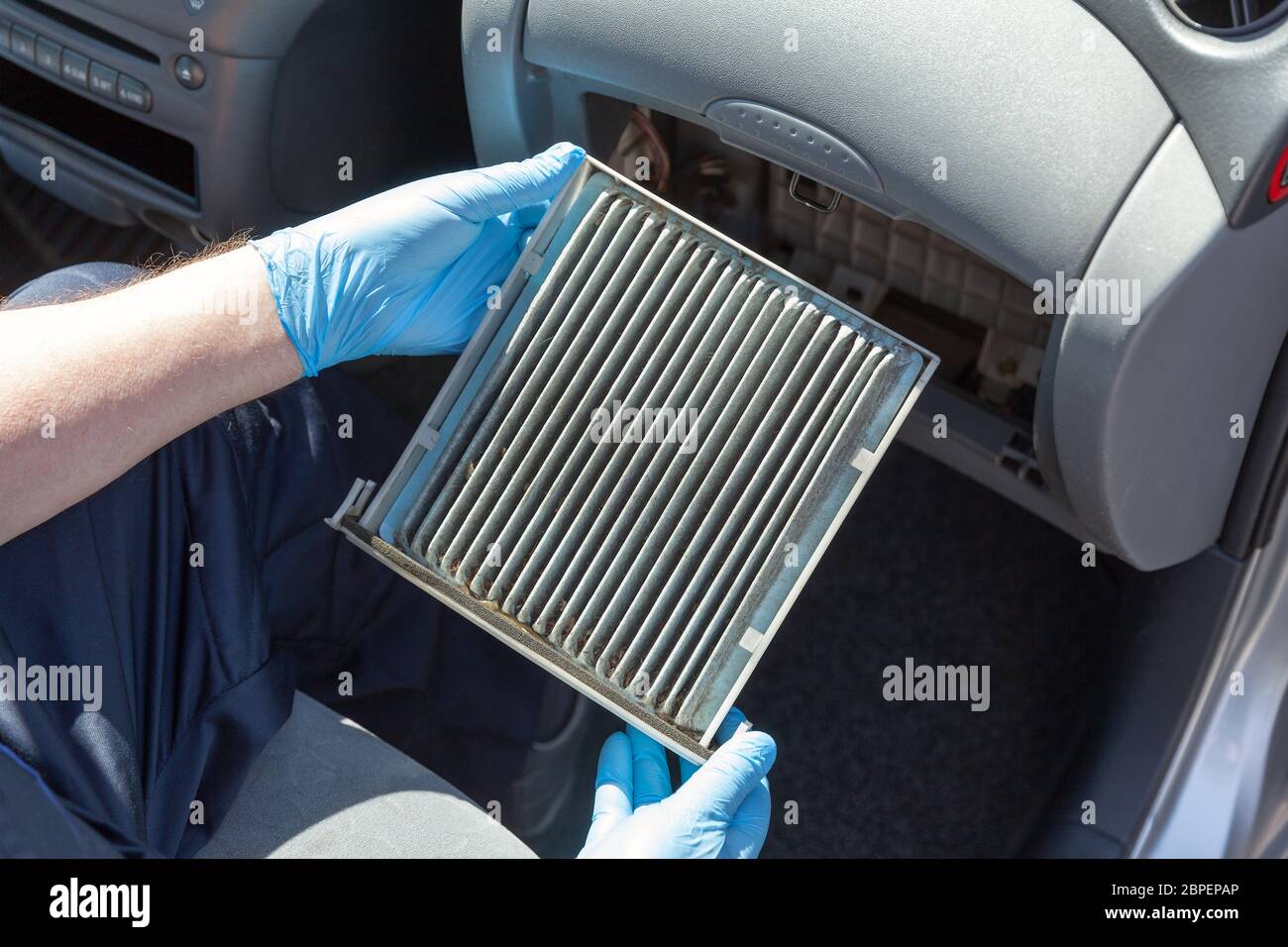 Replacing the old cabin air filter Stock Photo - Alamy