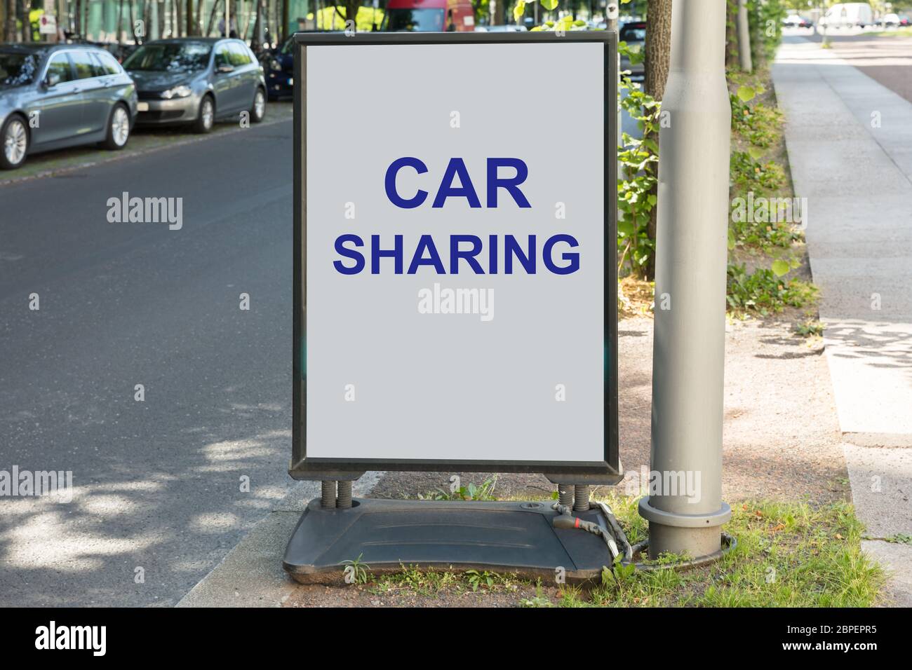 Car sharing sign on board by street in city Stock Photo - Alamy