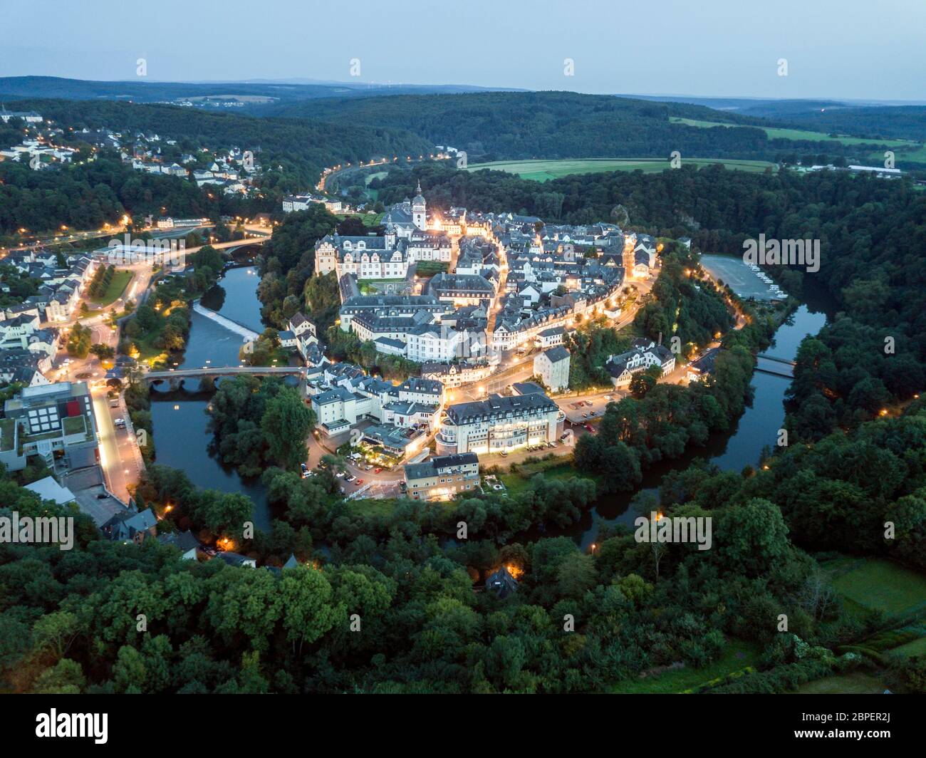 Aerial view over the old town of Weilburg illuminated at night. Limburg ...