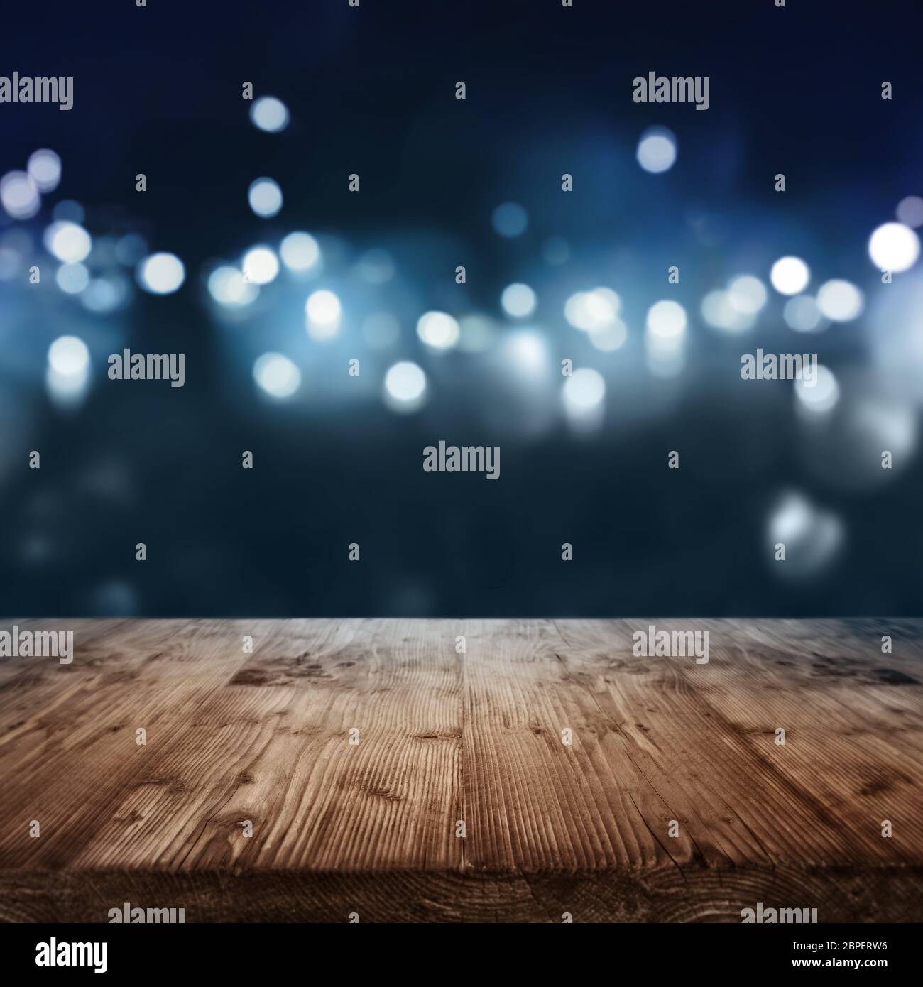 Abstract dark blue background with bright light effects in front of a ...