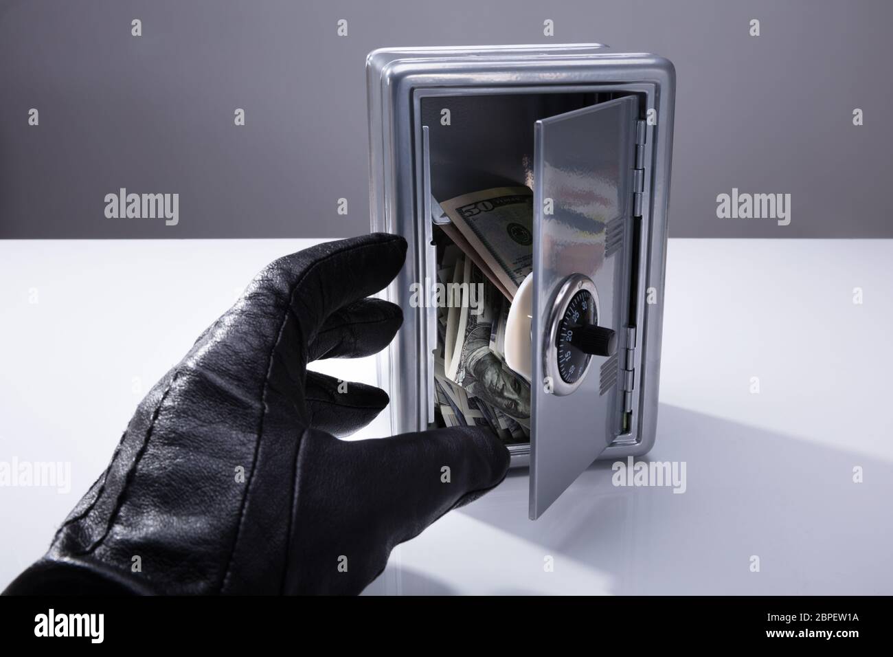 Close-up Of A Thief's Hand Wearing Gloves Stealing Banknotes From Open ...