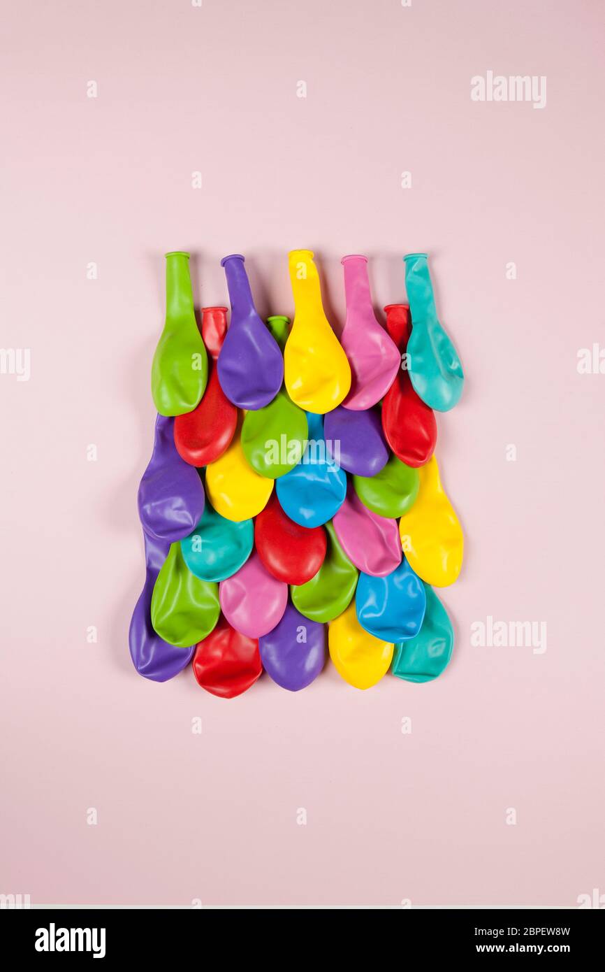 colorful deflated balloons arranged to represent a japanese pattern ...