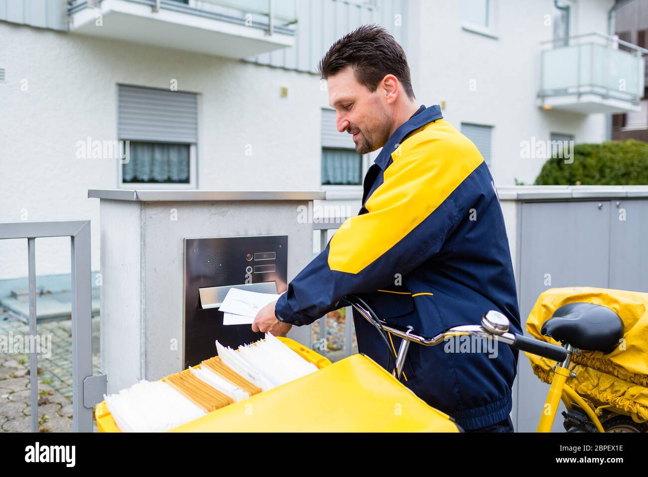 Postman delivering letters hi-res stock photography and images - Alamy