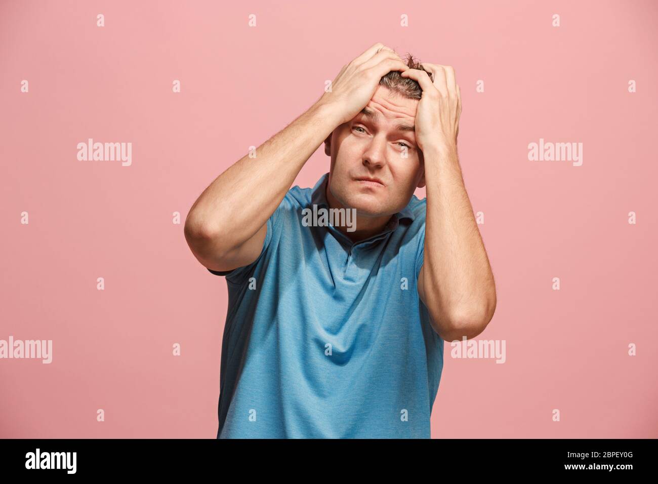 Horrible, stress, shock. Male half-length portrait isolated at pink ...