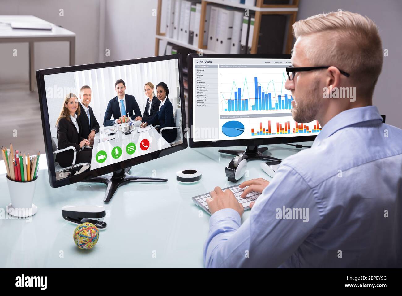 Group using video conferencing technology hi-res stock photography and ...