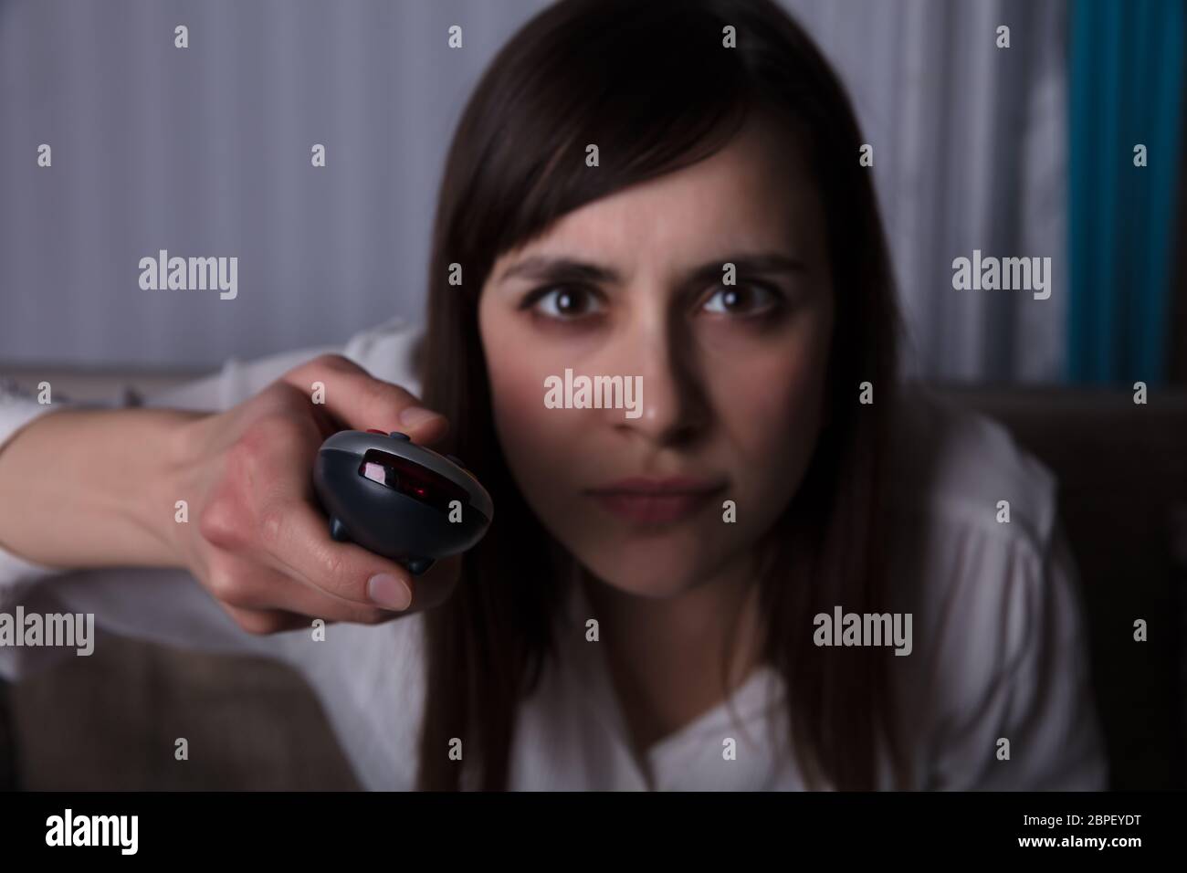 Pretty woman changing tv channel hi-res stock photography and images ...