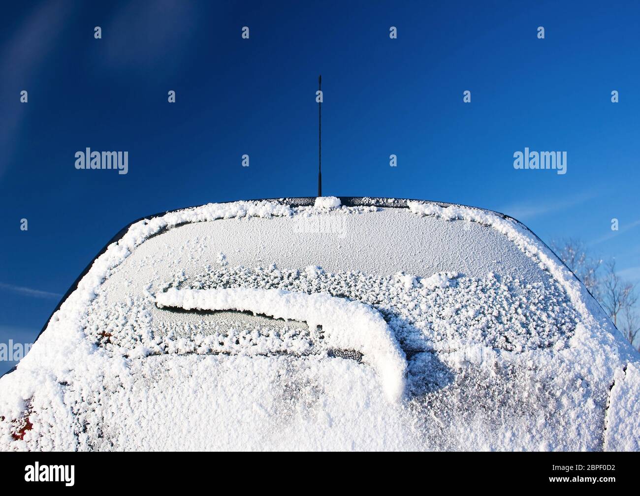 Rear car window covered with ice in winter Stock Photo - Alamy