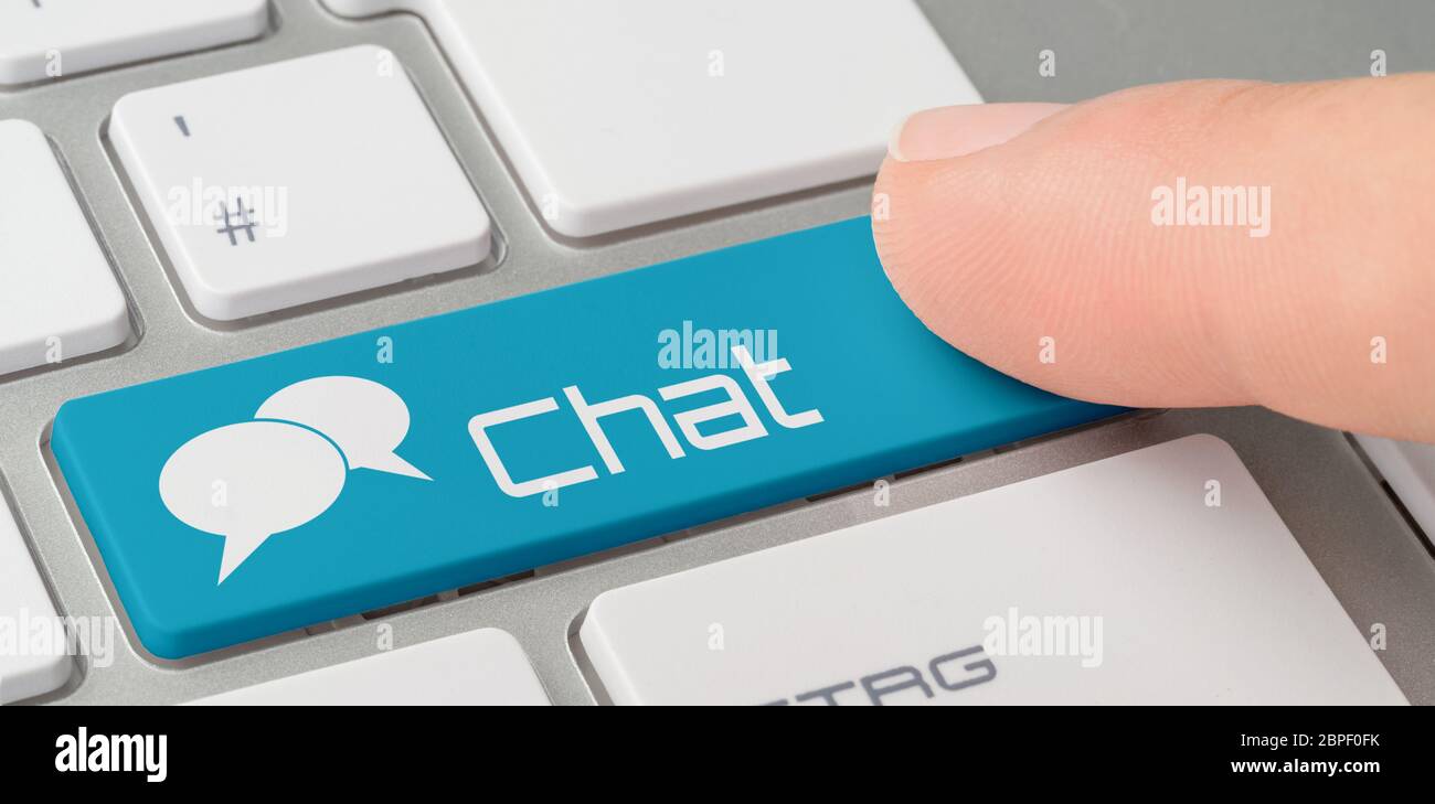 A keyboard with a blue labeled button - Chat Stock Photo - Alamy