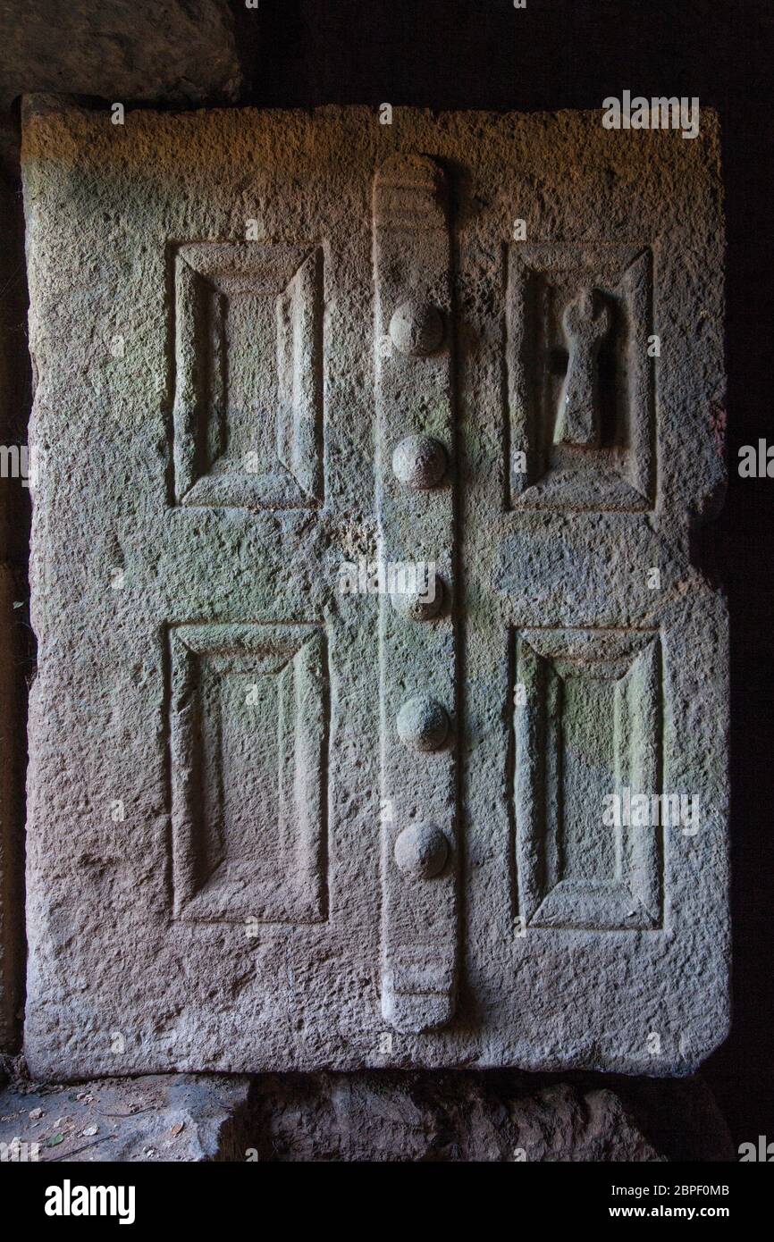 Basalt door with ‘iron’ bolts carved in stone at the entrance to a tomb ...