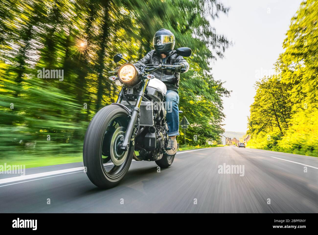 motorbike on the forest road riding. having fun driving the empty road ...