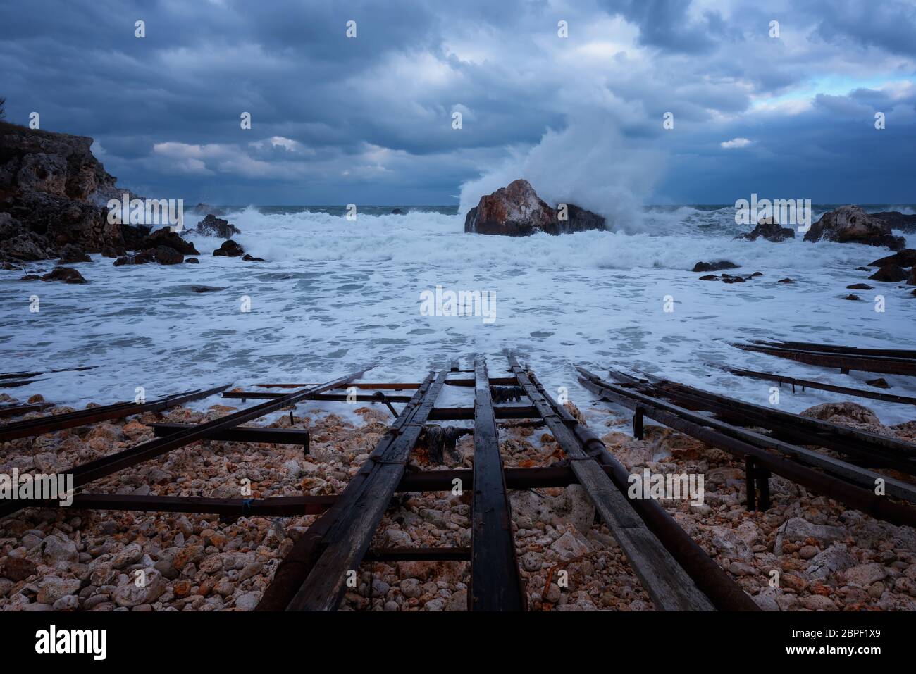 Dramatic nature background - big waves and dark rock in stormy sea ...