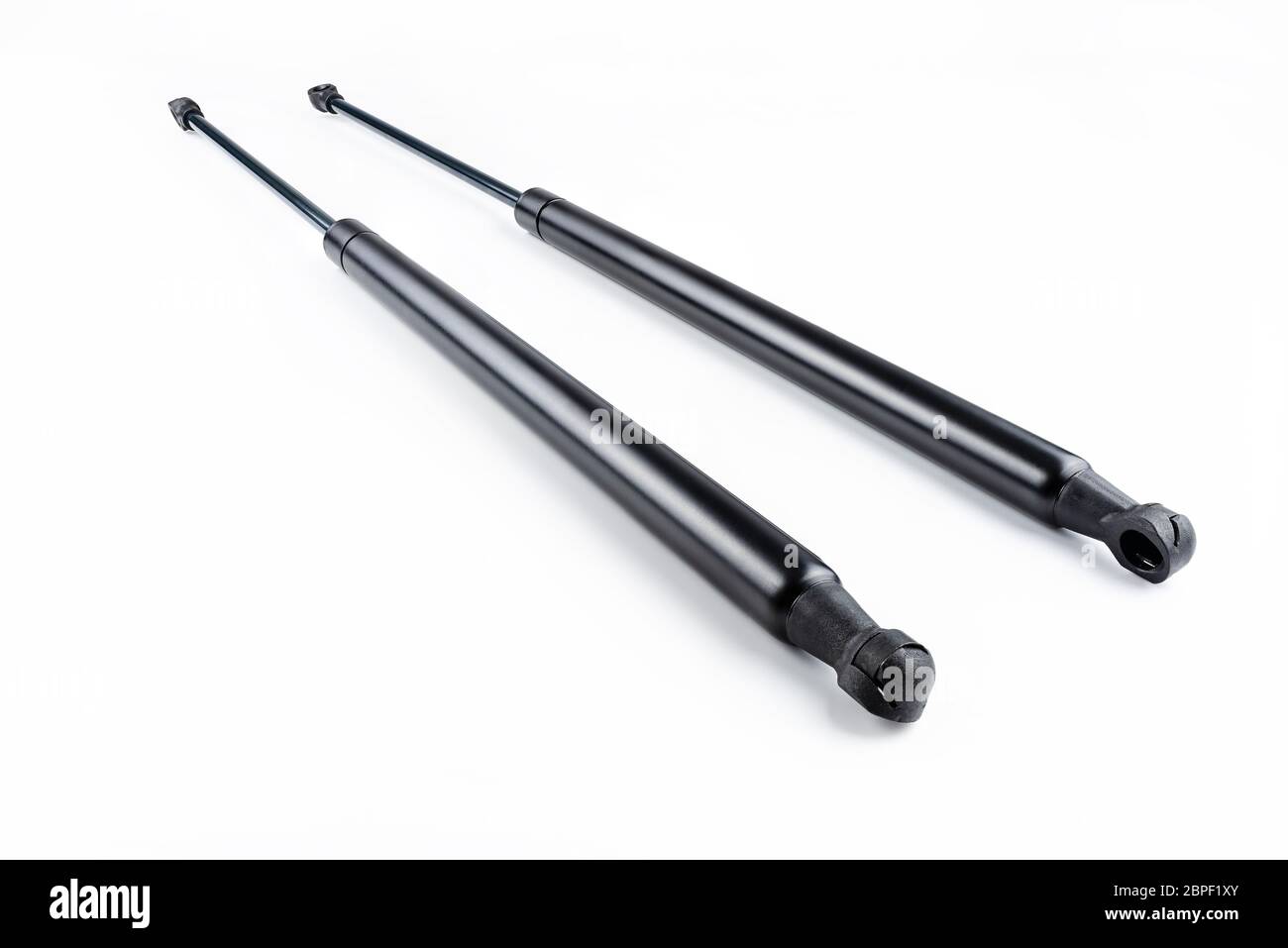 Two new gas springs, shock absorbers, isolated on white background with ...