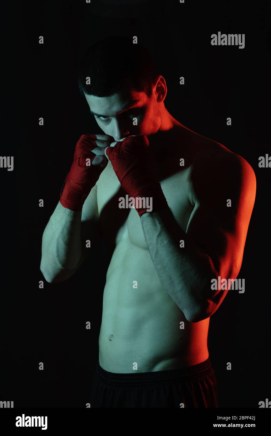 Boxer male fighter posing in confident defensive stance with hands in ...
