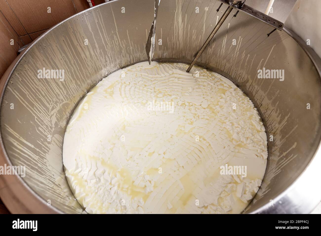 Traditional cheese making at a creamery Stock Photo - Alamy