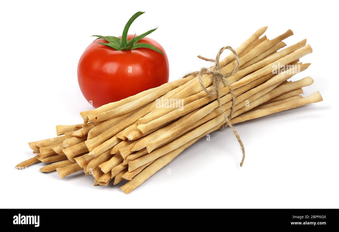 Crispy crunchy long bread sticks with tomato, isolated on a white ...