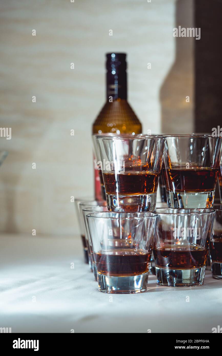 Pyramid of glasses of alcohol made in a pyramid for event party or ...