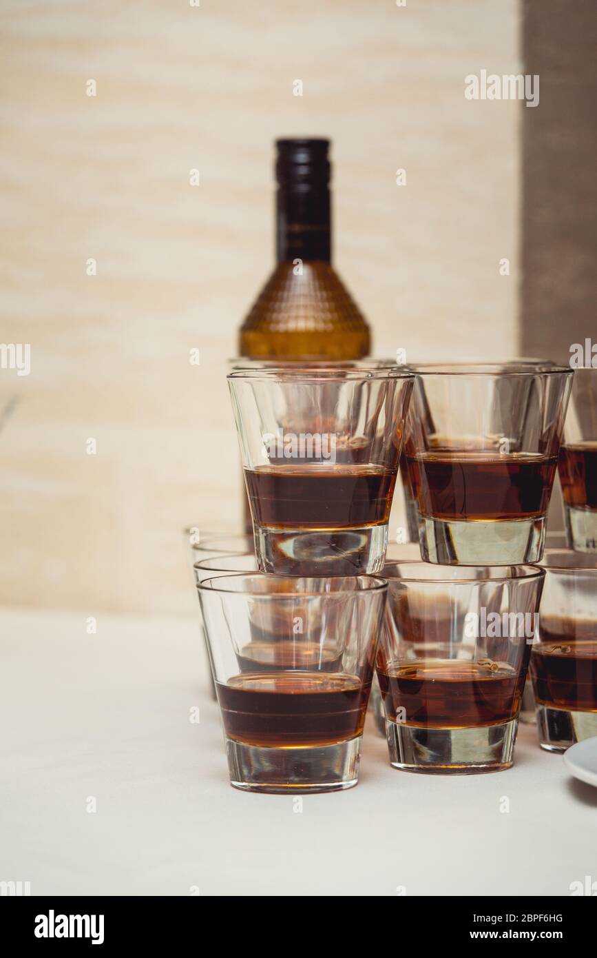 Pyramid of glasses of alcohol made in a pyramid for event party or ...