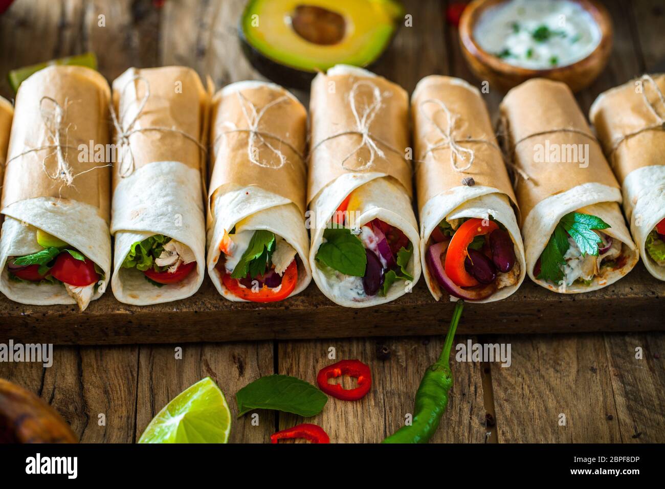 Tortilla wraps with vegetables. Mexican tortillas. Tacos with nachos ...