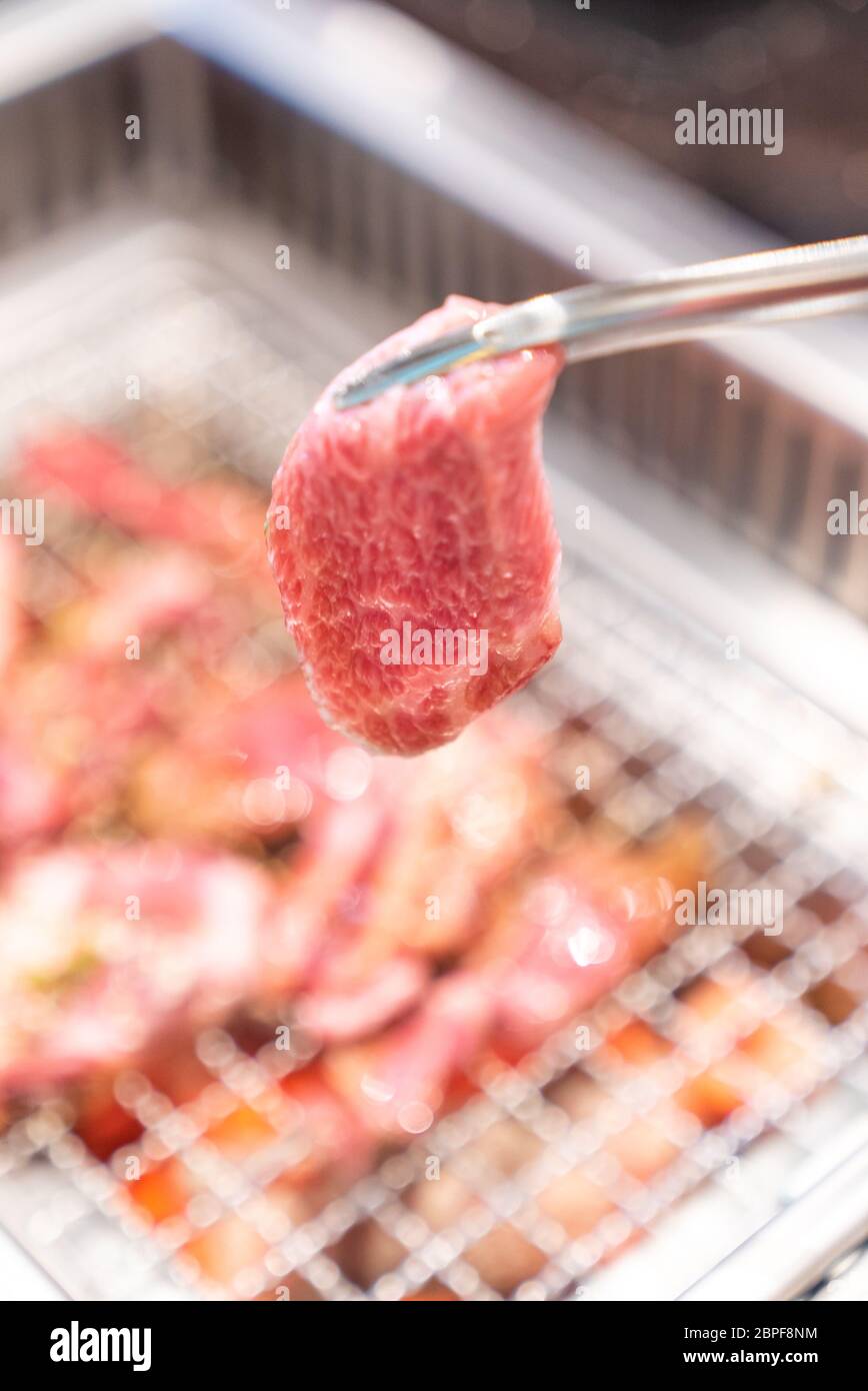 grilled japanese wagyu premium beef yakiniku with red hot charcoal ...