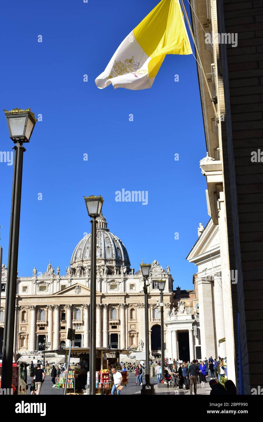 Flag of the Vatican and St. Peter’s Square with the St. Peter’s ...