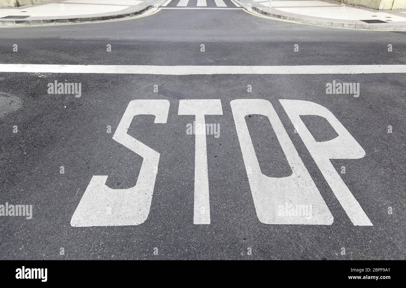 Stop sign on asphalt, detail signal circulation in the city, security ...
