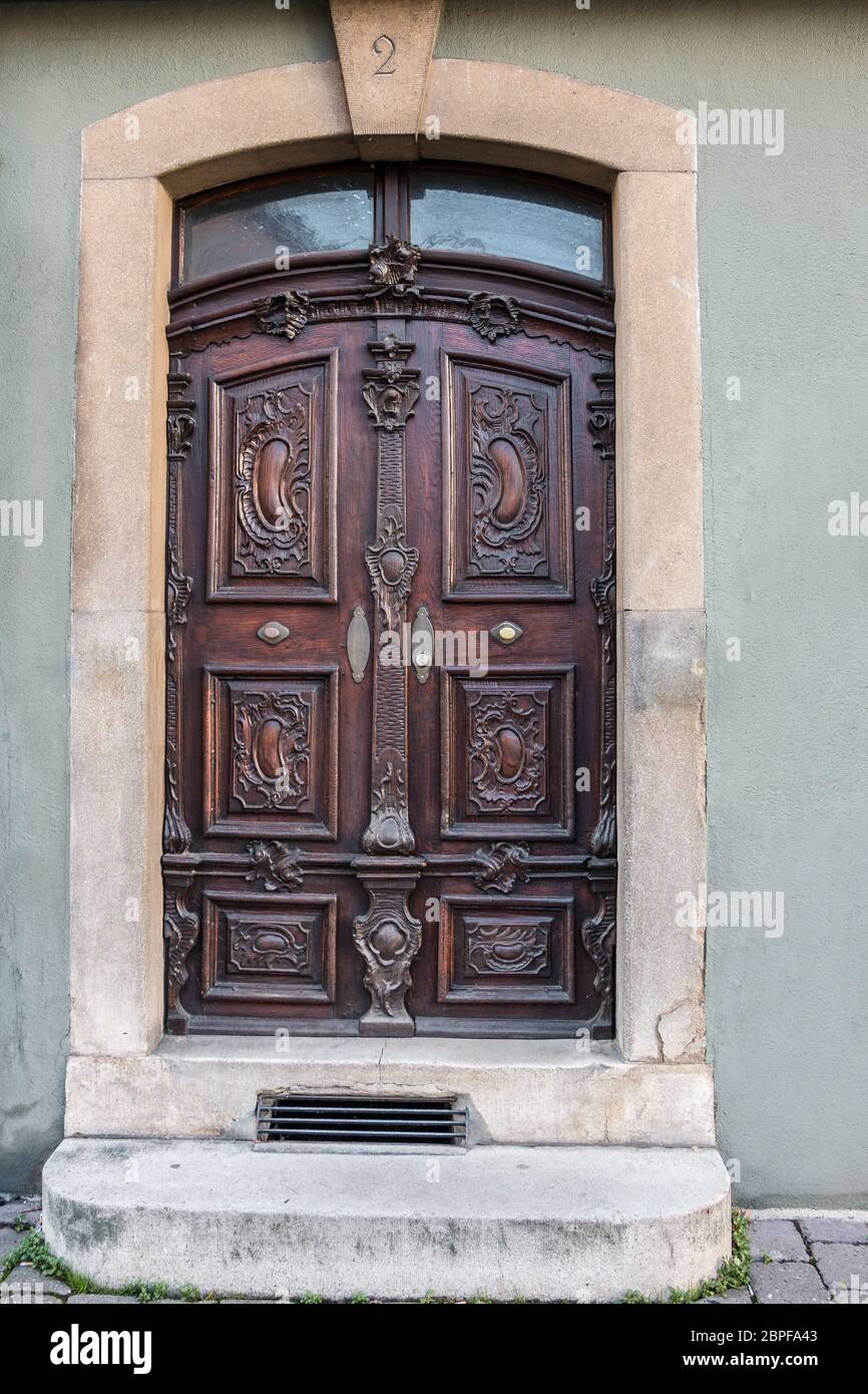 Old door of a historical building with stairway and house number Stock ...