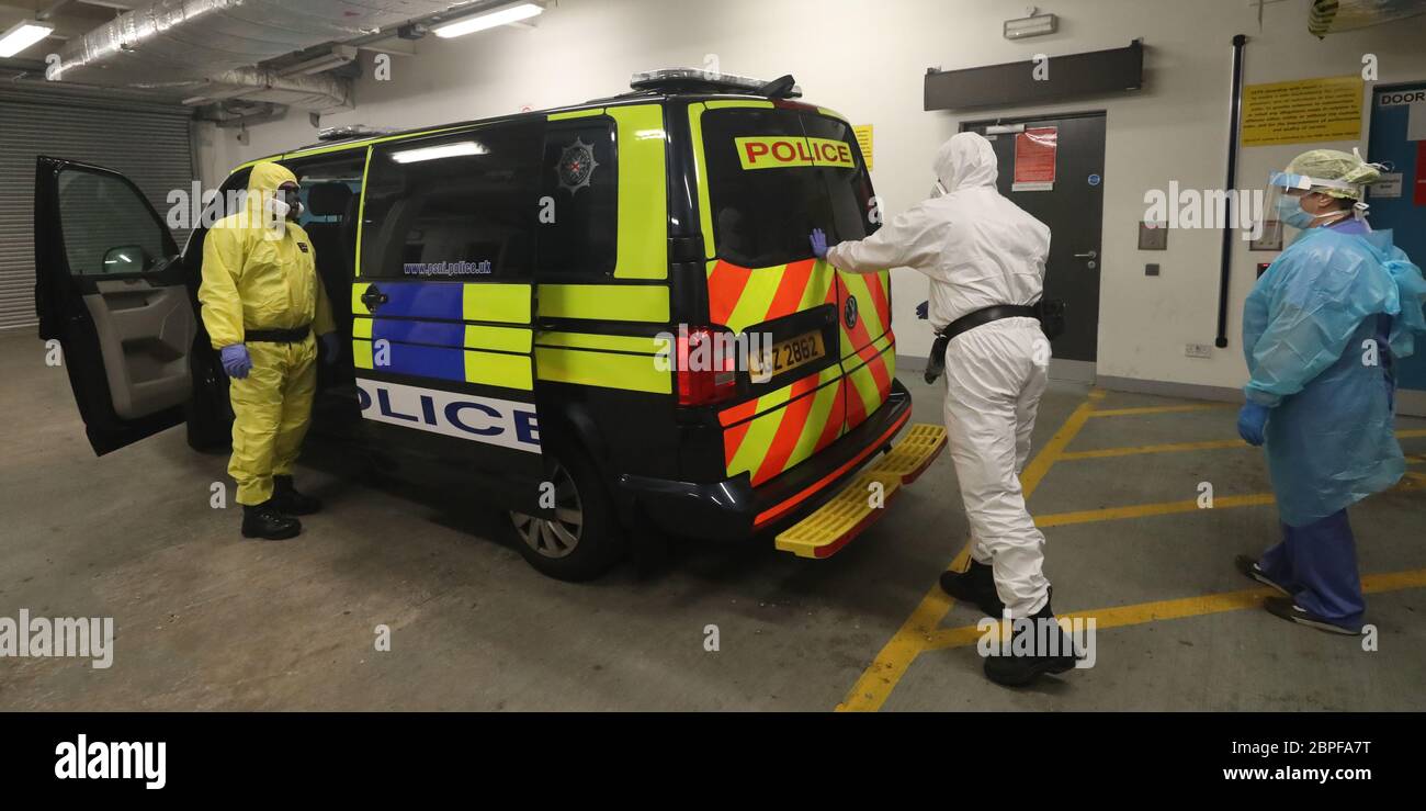 Members of the PSNI Covid-19 unit and a nurse at Musgrave Custody Suite ...