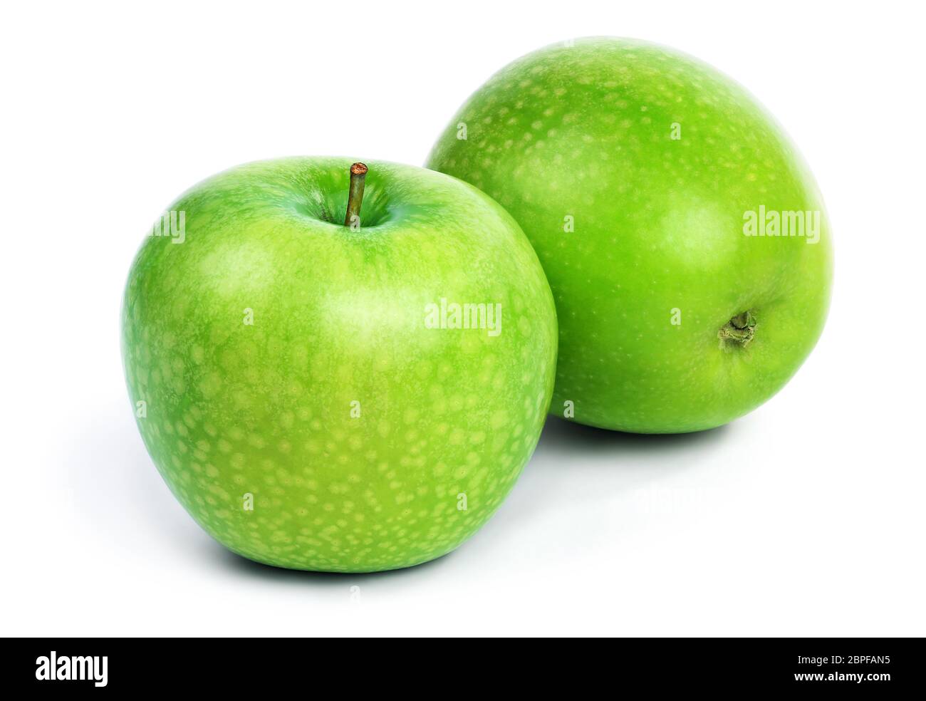 Green ripe Apple fruits of the same variety isolated on white ...