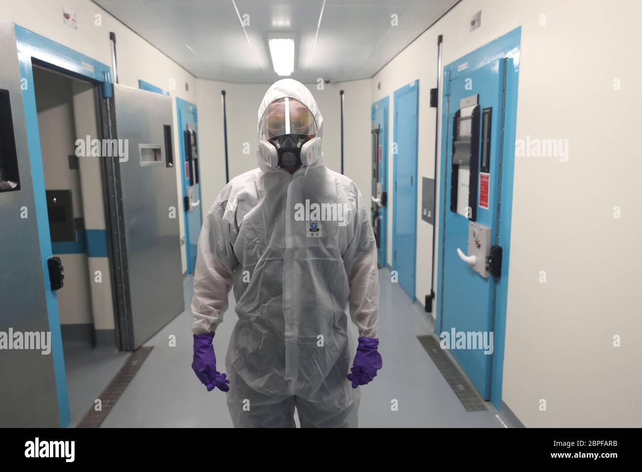A member of the PSNI Musgrave Street custody team wearing the PPE ...