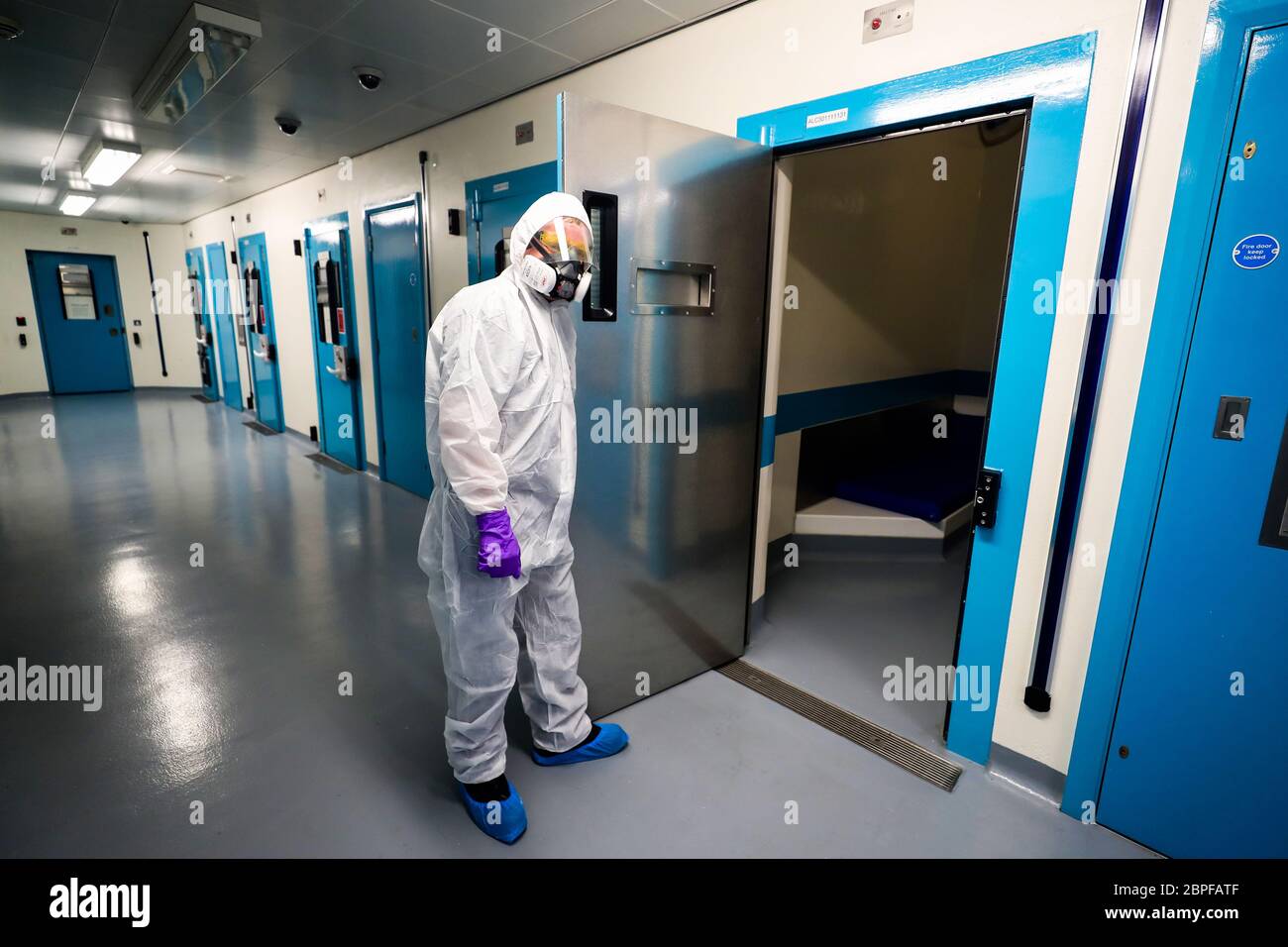 A member of the PSNI Musgrave Street custody team wearing the PPE ...