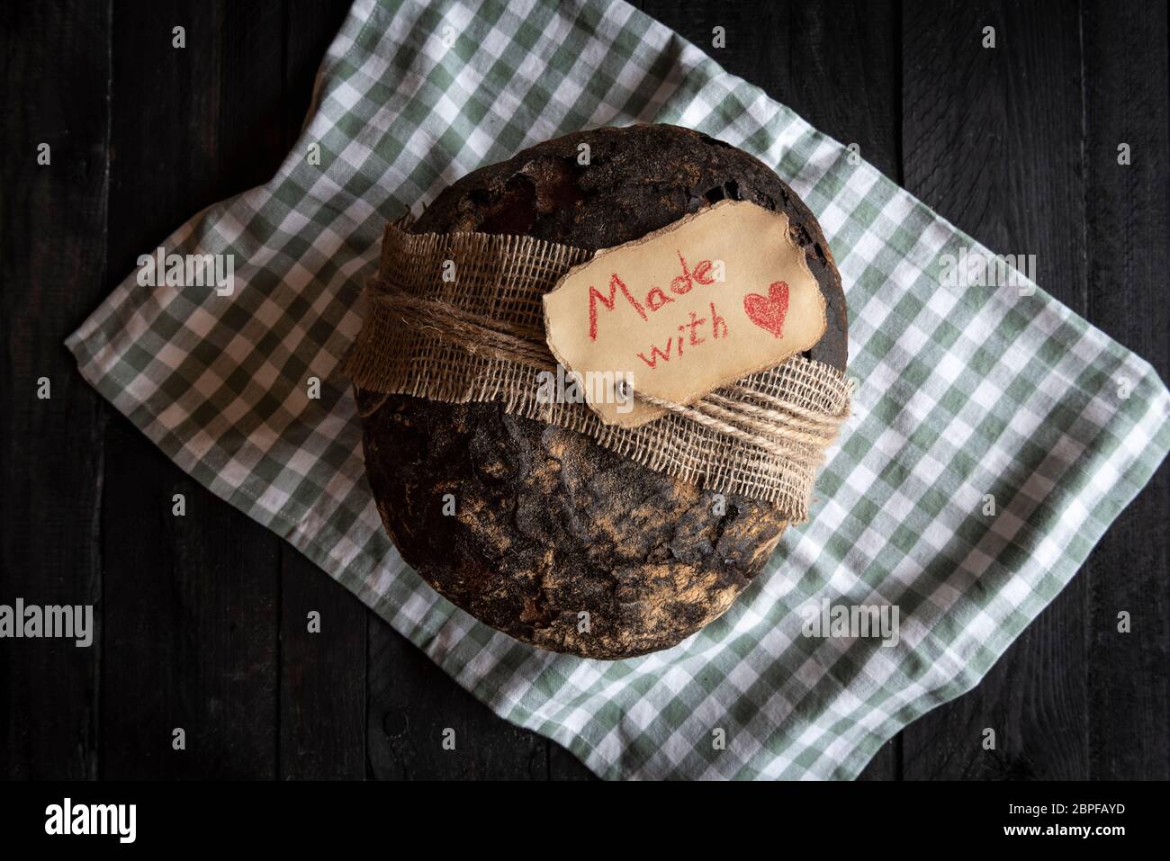 Home baked brown bread tied with a rope and a handwritten message Stock ...
