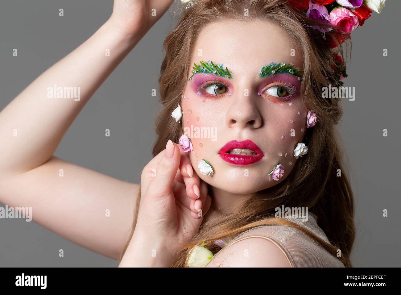 Beautiful spring girl model. Fabulous floral makeup. The face of a girl ...
