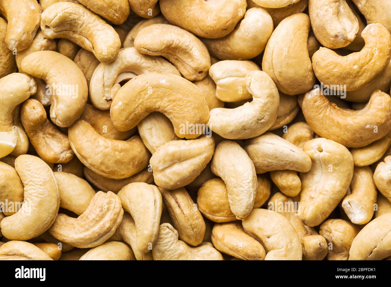 Roasted cashew nuts. Texture of nuts. Top view Stock Photo - Alamy