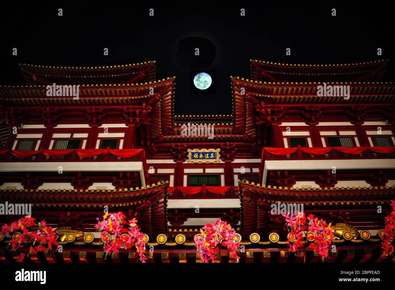 beautiful white moon sitting atop a temple Stock Photo - Alamy