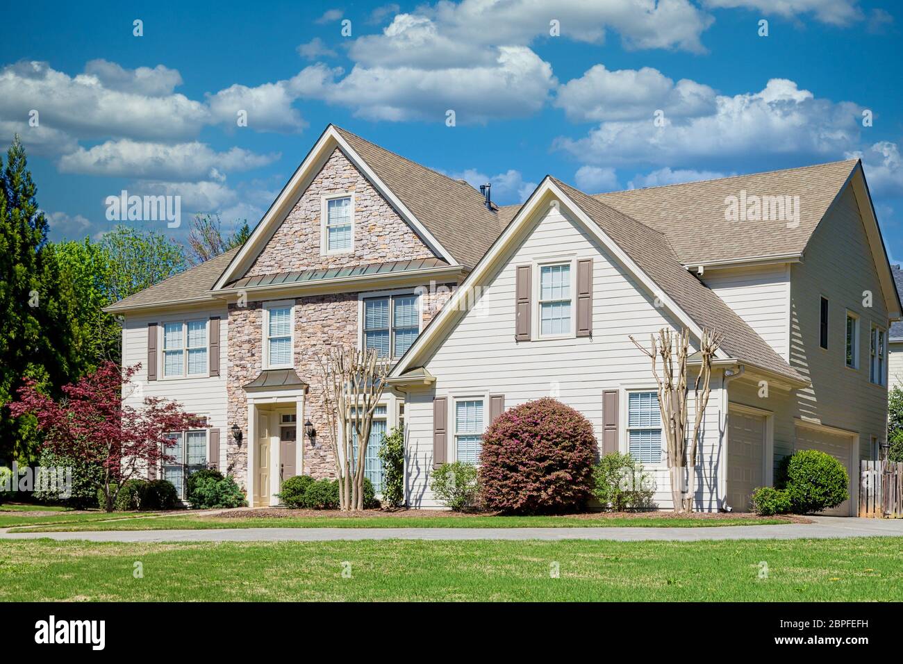 Siding and Stone House in Spring Stock Photo - Alamy