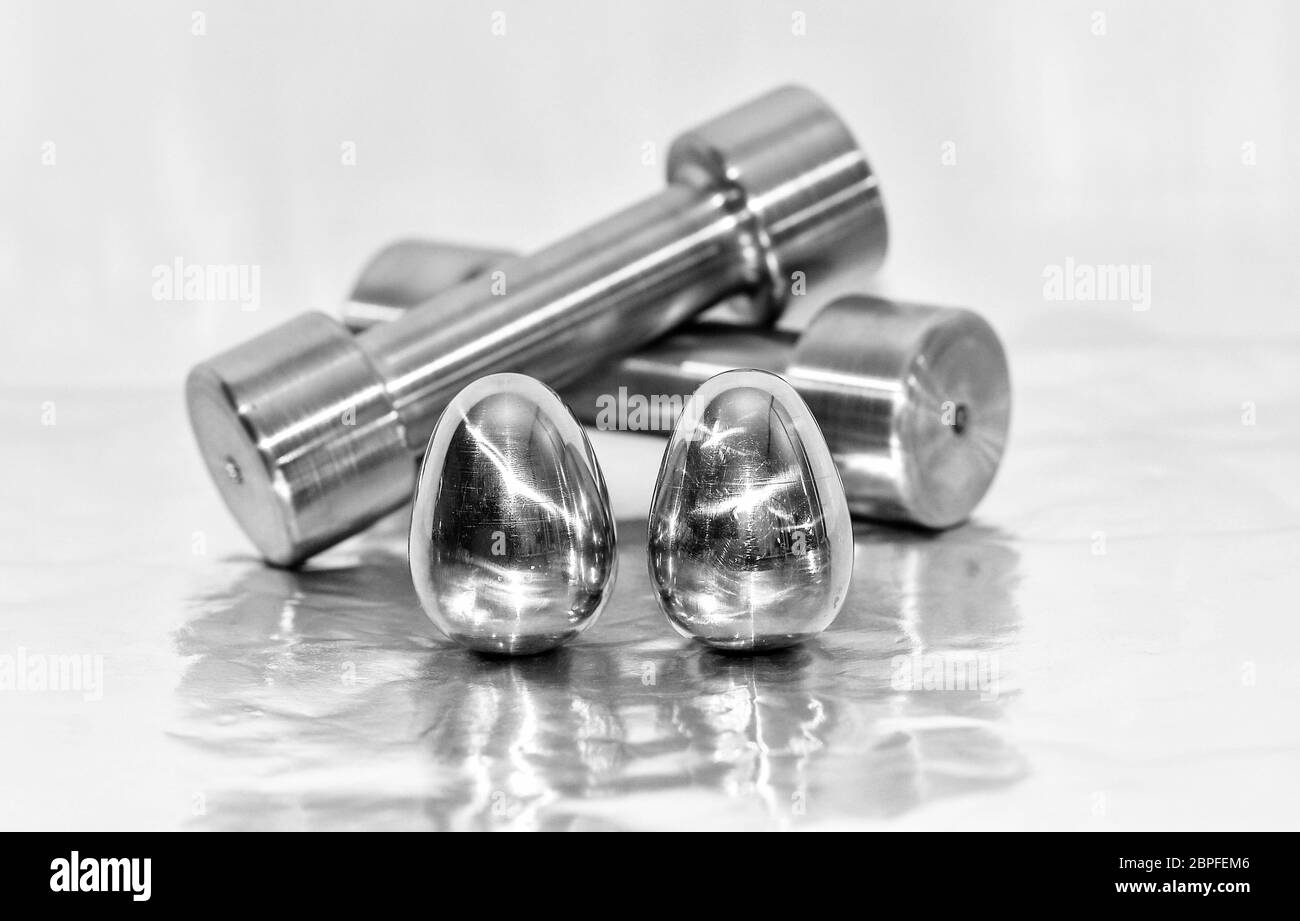 Metal dumbbells and steel eggs, the concept of sports training and the ...