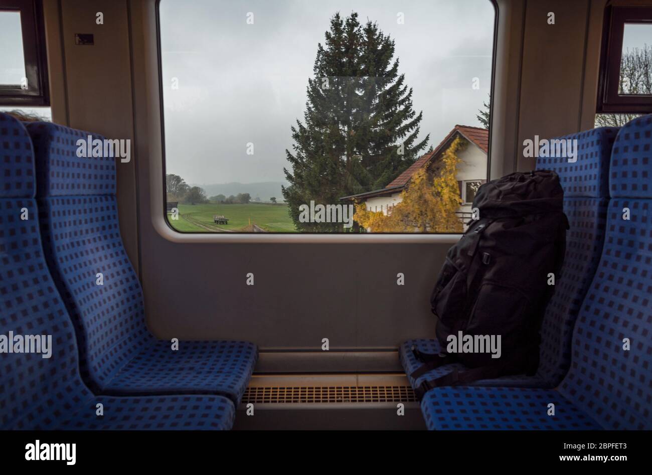 German train interior with a rucksack on the seats and a bavarian ...