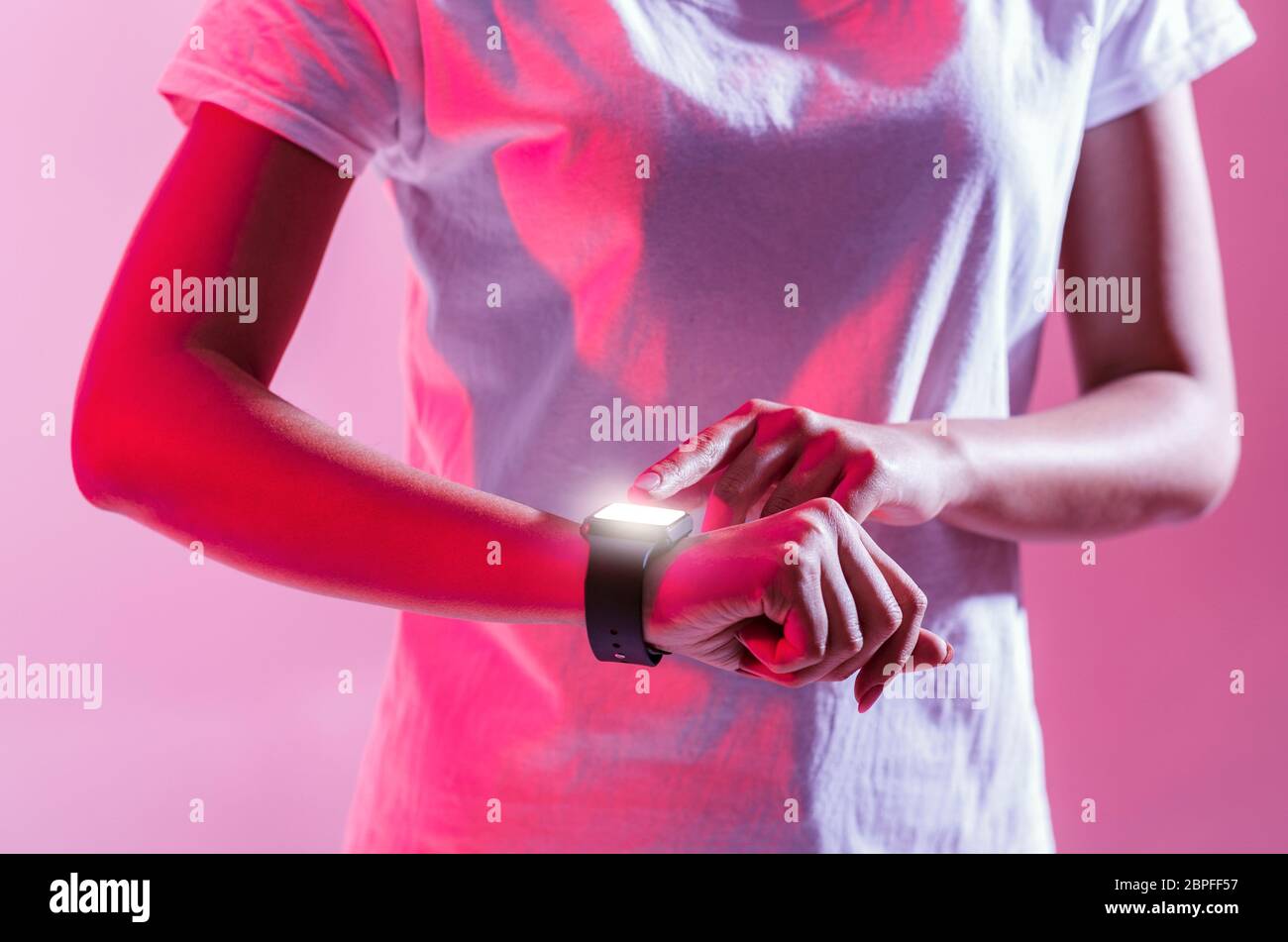 Modern technology for everyone. Girl clicks on smartwatch Stock Photo ...
