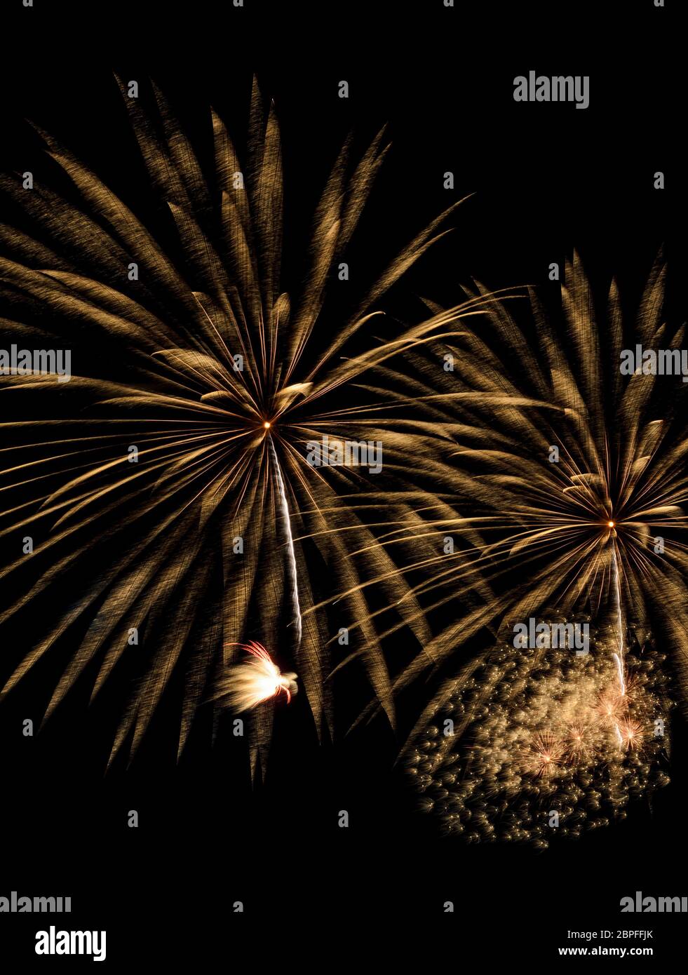 Golden exploded fireworks display, isolated on black background Stock ...