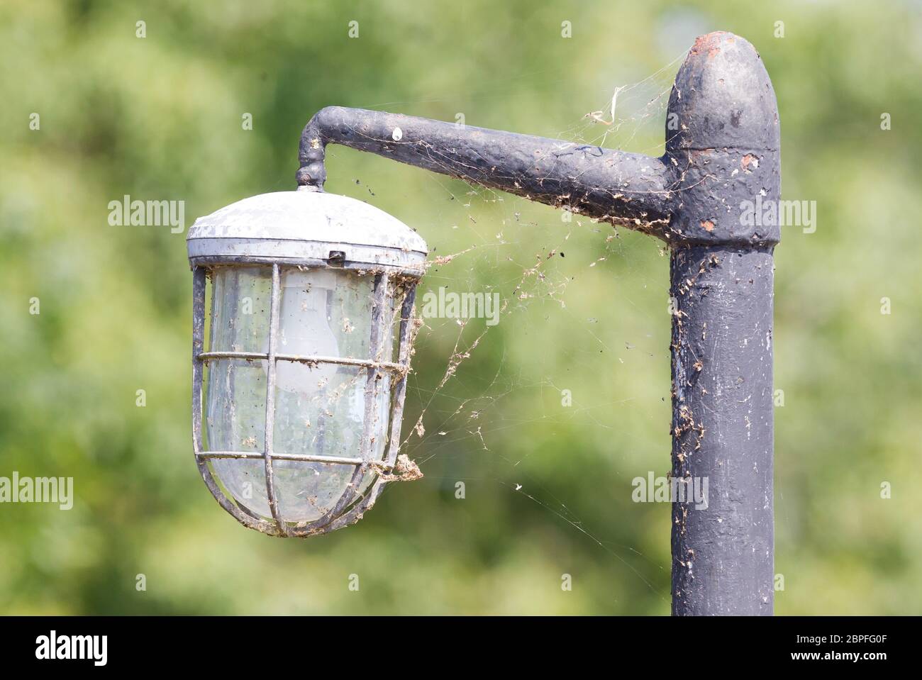 Simple street lamp-post, old vintage lamp hanging Stock Photo - Alamy