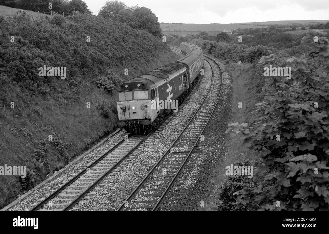 Class 50 diesel locomotive No. 50049 "Defiance" pulling a passenger ...