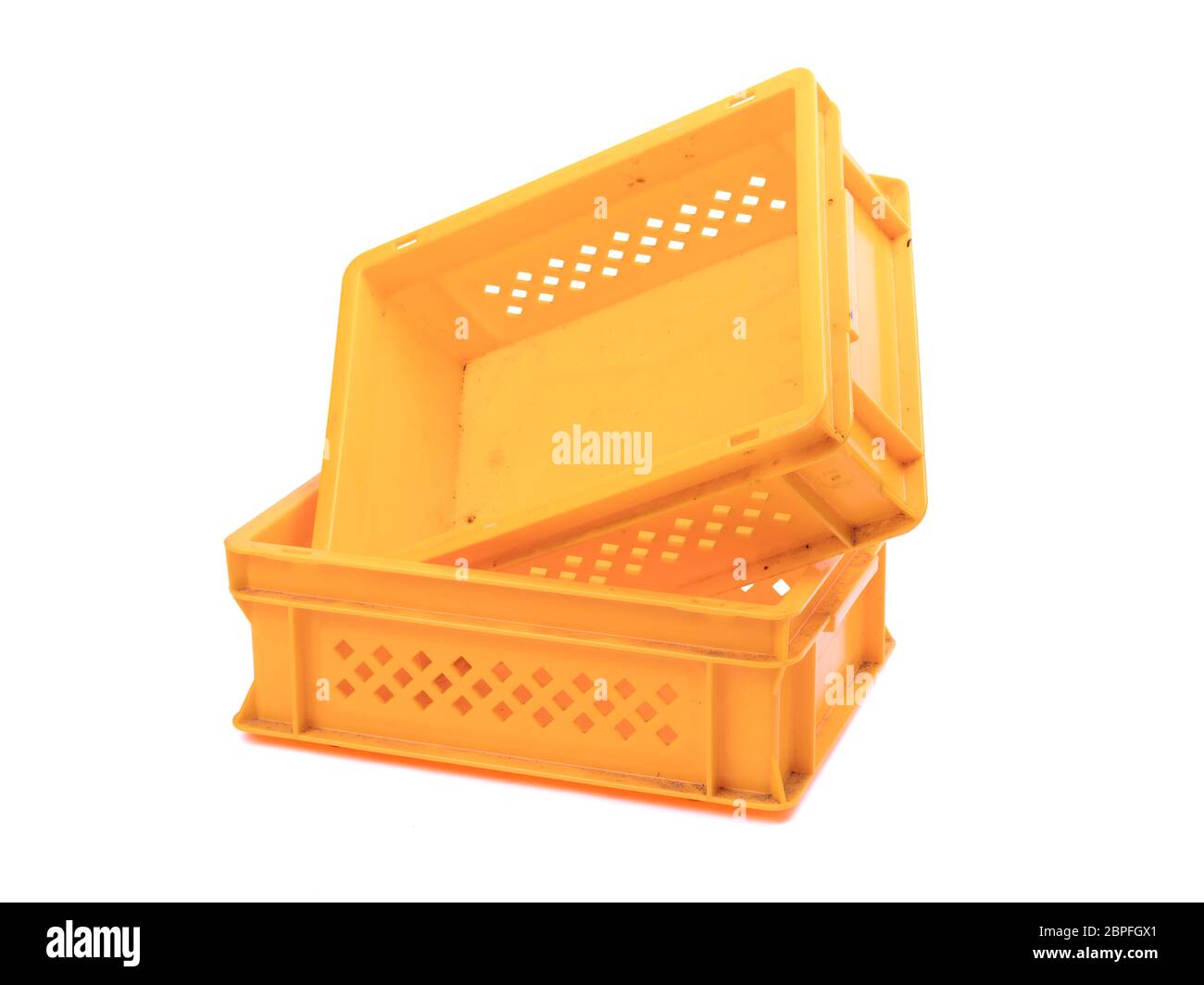 Empty yellow plastic crates isolated on white Stock Photo - Alamy
