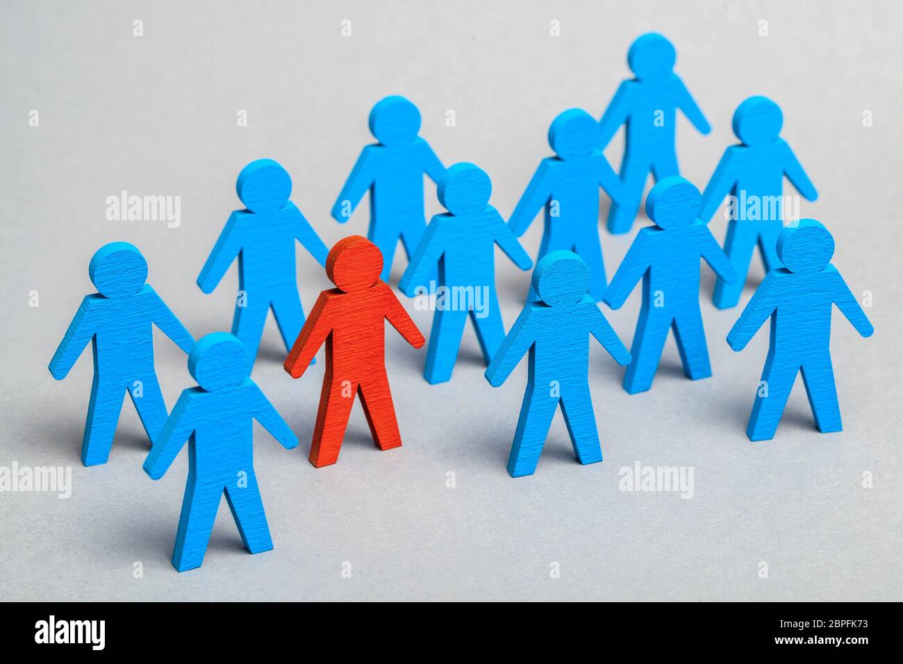Team Leader. HR. The right choice of staff. Blue men and red leader ...
