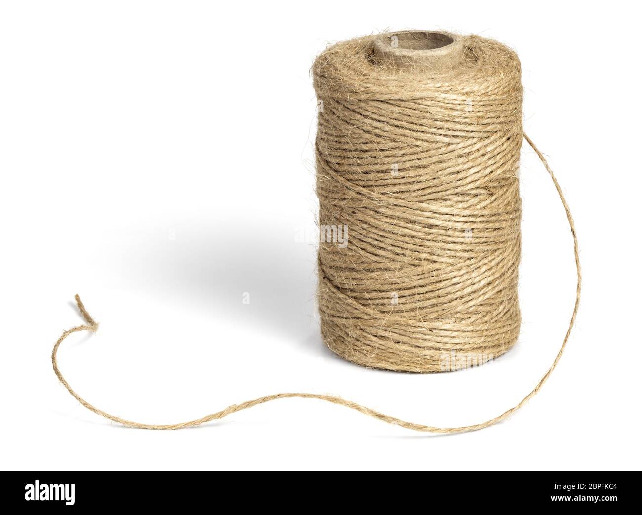 Coil of jute rope for packing, isolated on a white background Stock ...