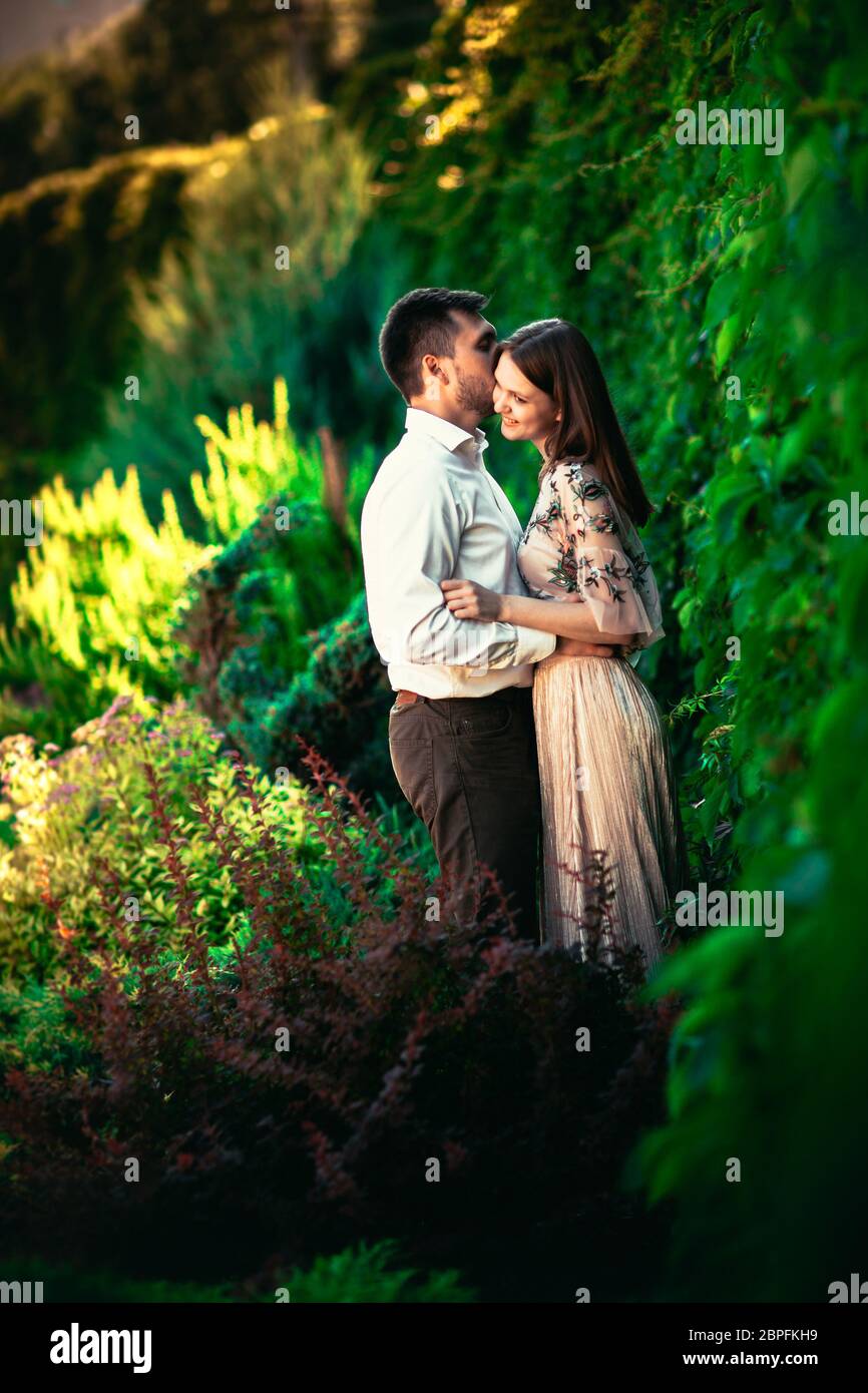 Beautiful young couple on a nature background Stock Photo - Alamy