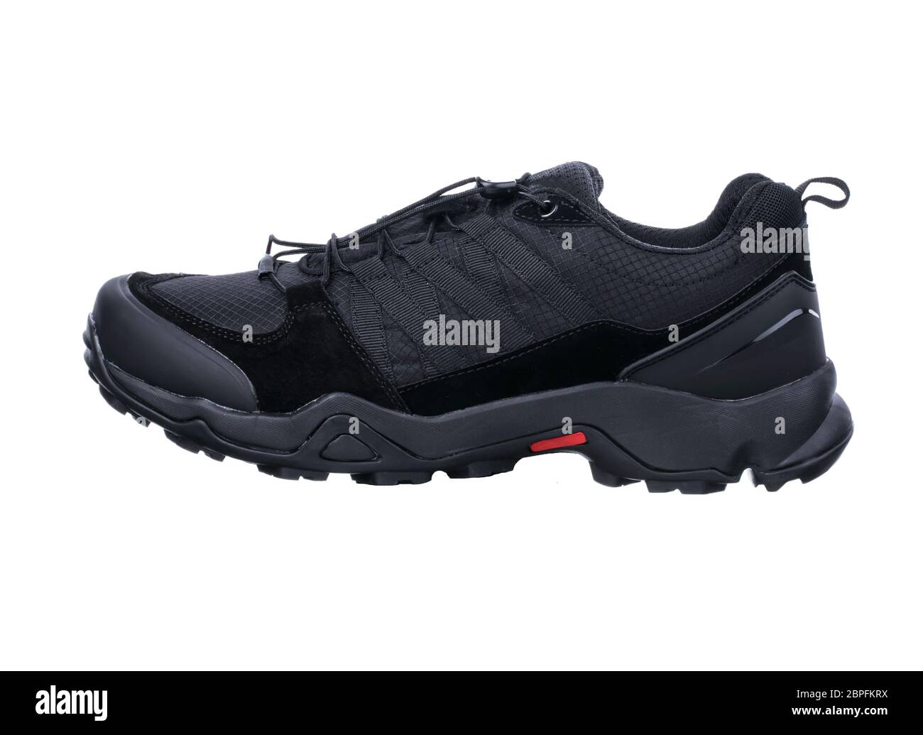 Black sneaker side view on a white background Stock Photo - Alamy