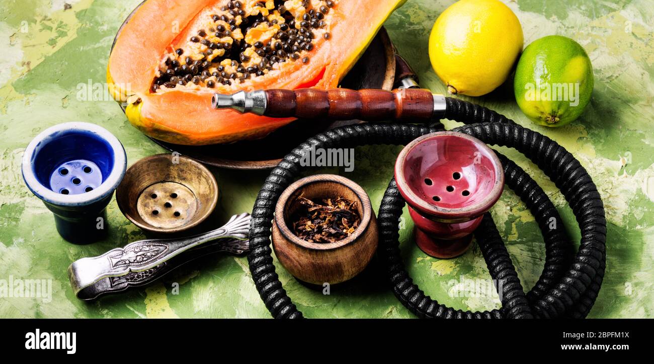 Oriental exotic hookah with papaya fruit flavor.Smoking Turkish shisha ...