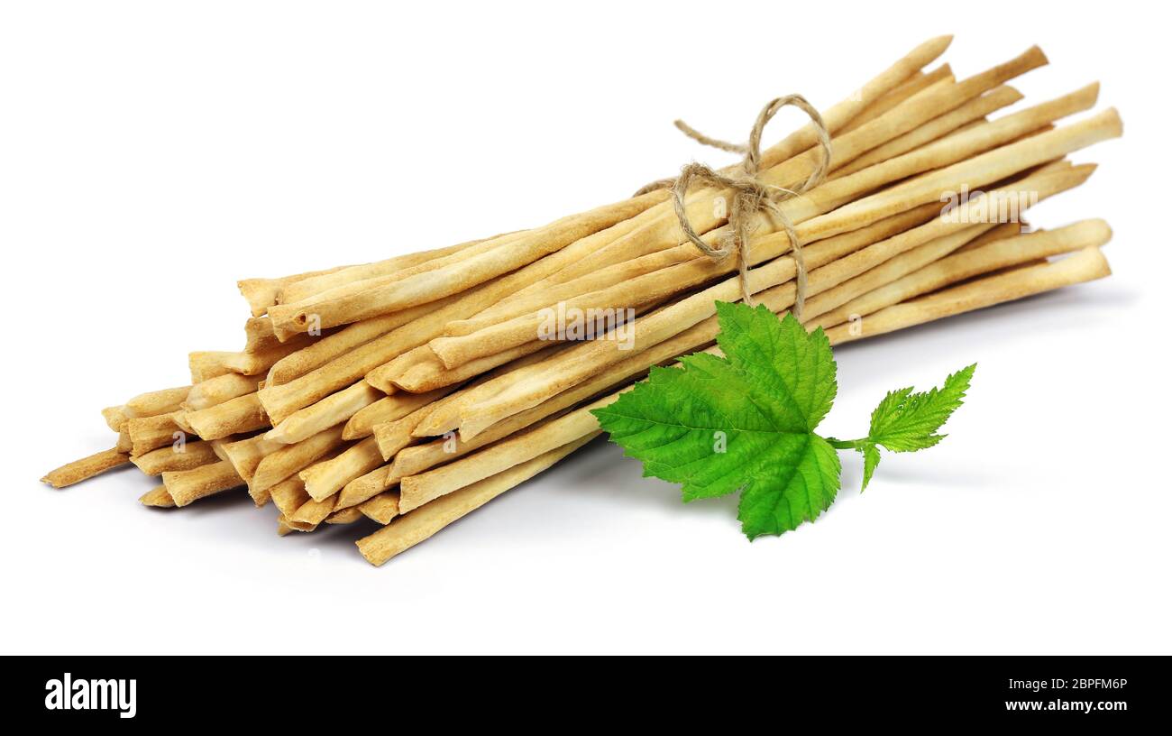 Crispy crunchy long bread sticks with green leaf, isolated on a white ...