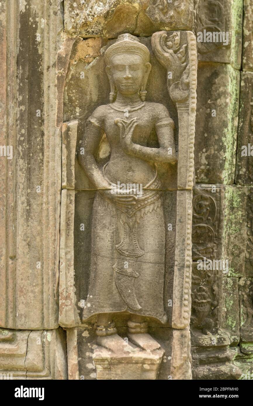 Bas-relief of standing woman in temple wall Stock Photo - Alamy